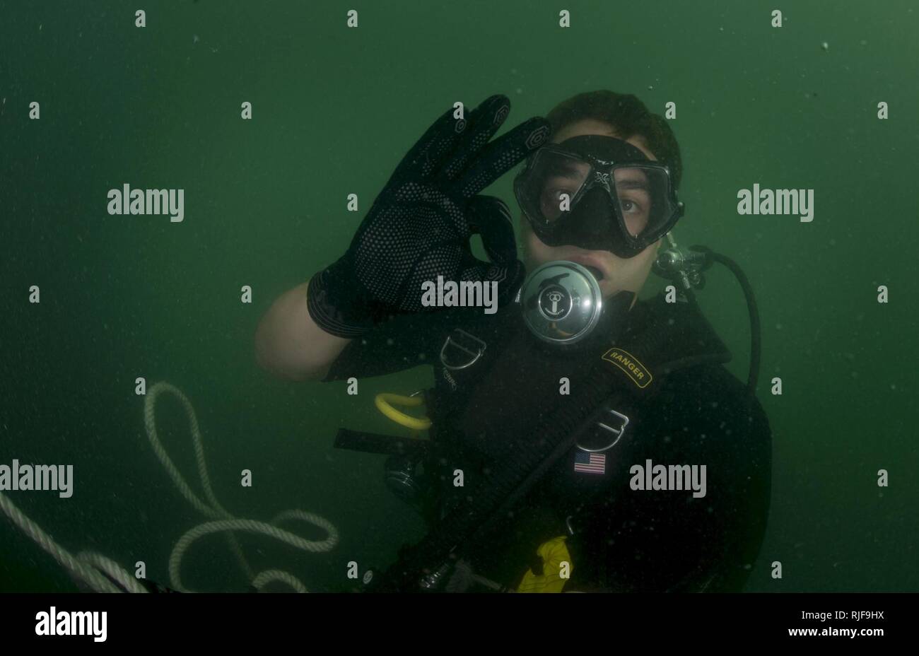 Navy Diver 2nd Class Markus Yensick, assigned to Commander Task Group ...