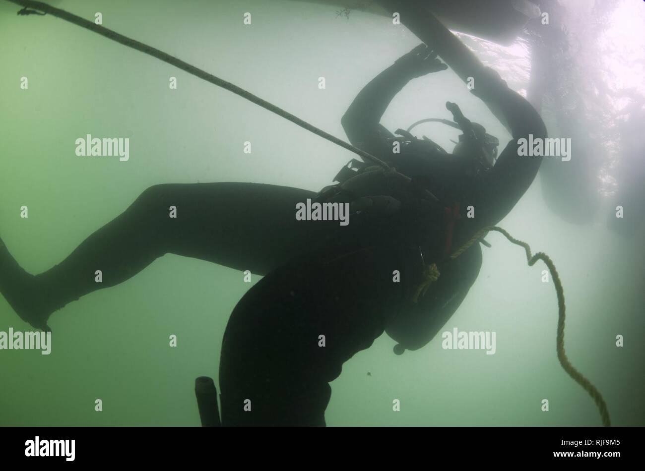 MINA SALMAN PIER, Bahrain (Feb. 13, 2013) Navy Diver 1st Class Ben Cohn ...