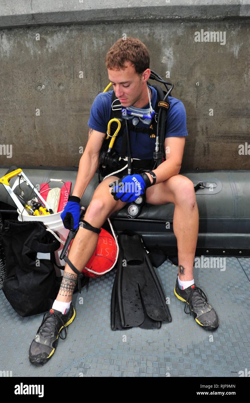 Navy Diver 3rd Class Chad Crawford, assigned to Mobile Diving and ...