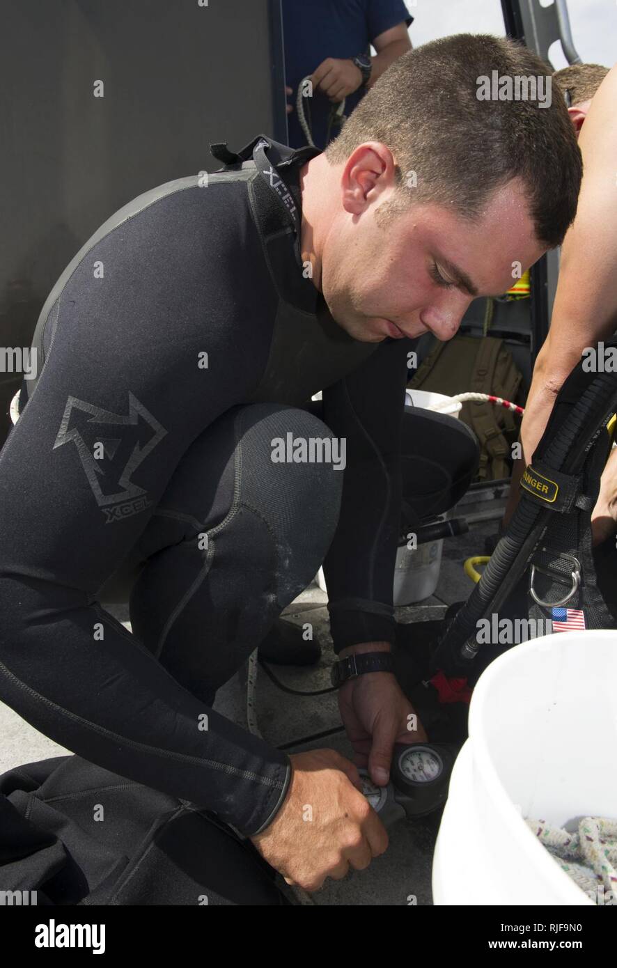 Navy Diver 2nd Class Steven Starner, assigned to Mobile Diving and ...