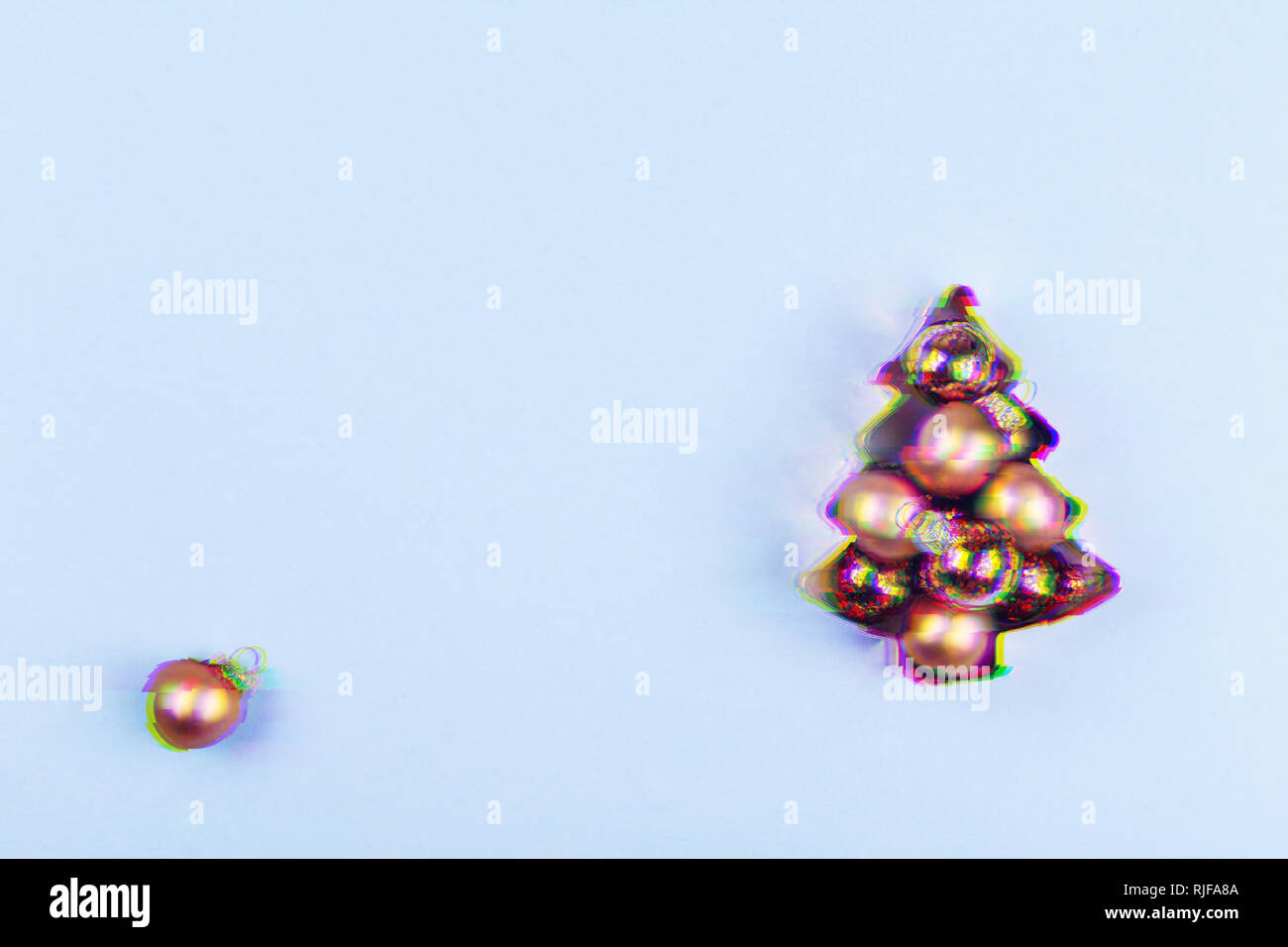 Holiday tree copper cookie cutter full of rose gold rounds on blue ...