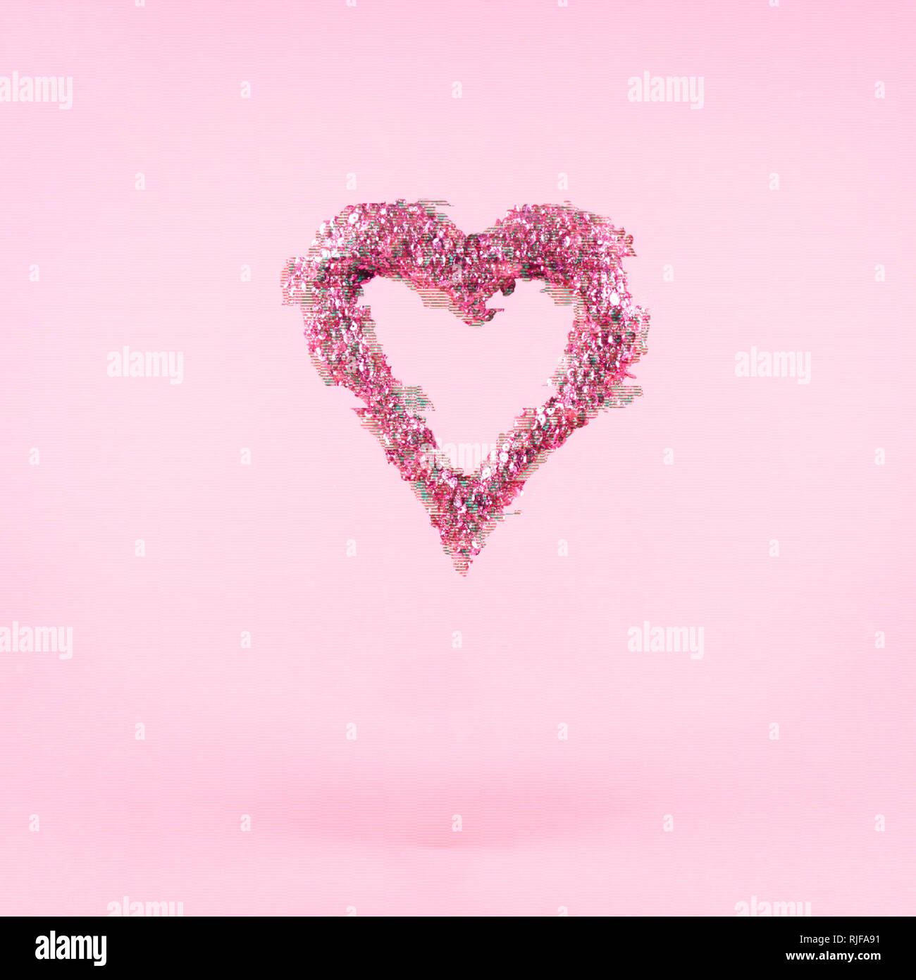 Glitter heart on pink background. Valentines day and love concept ...