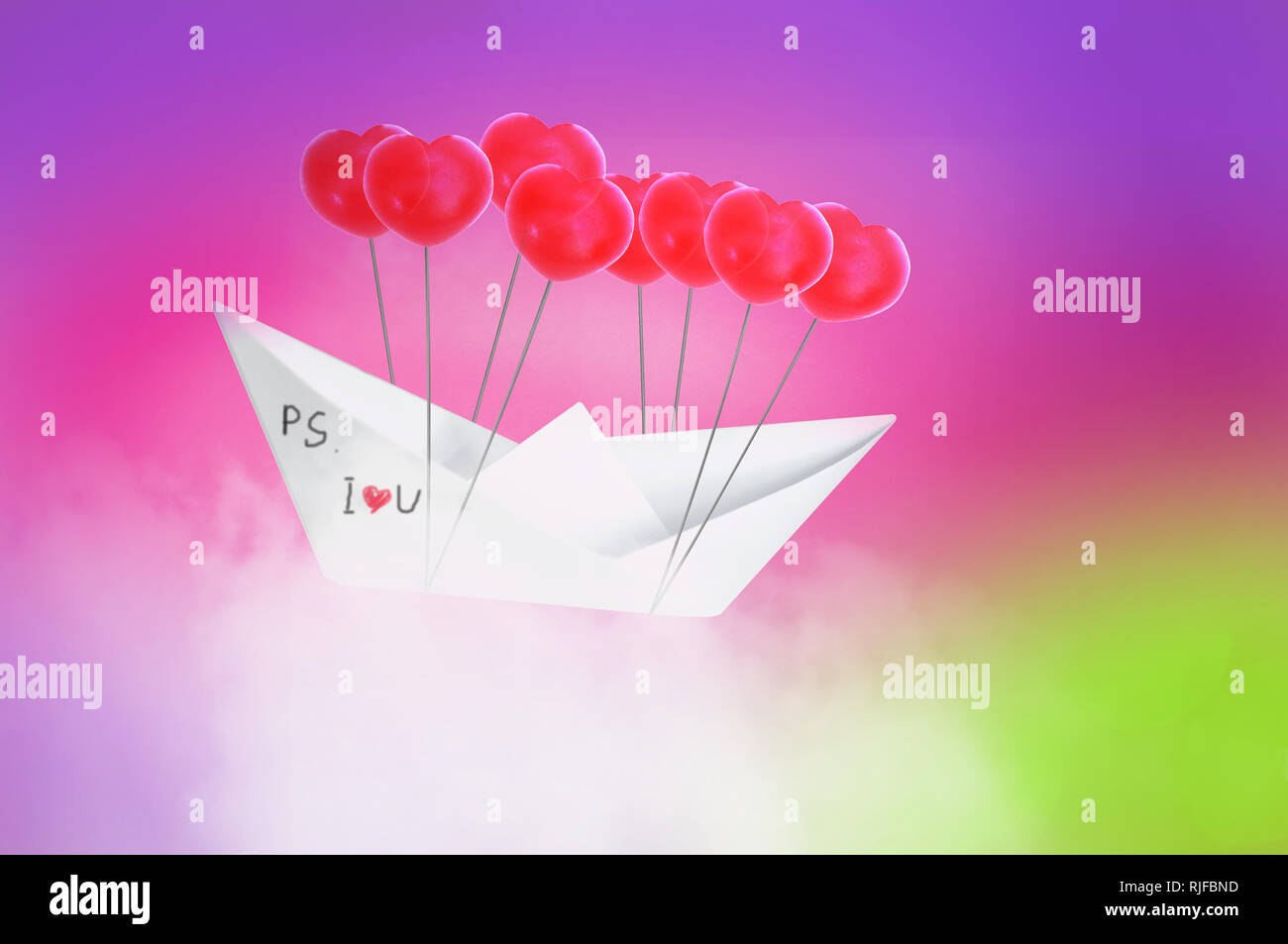 Paper boat with red heart shape balloon flying on Blue sky and clouds ...