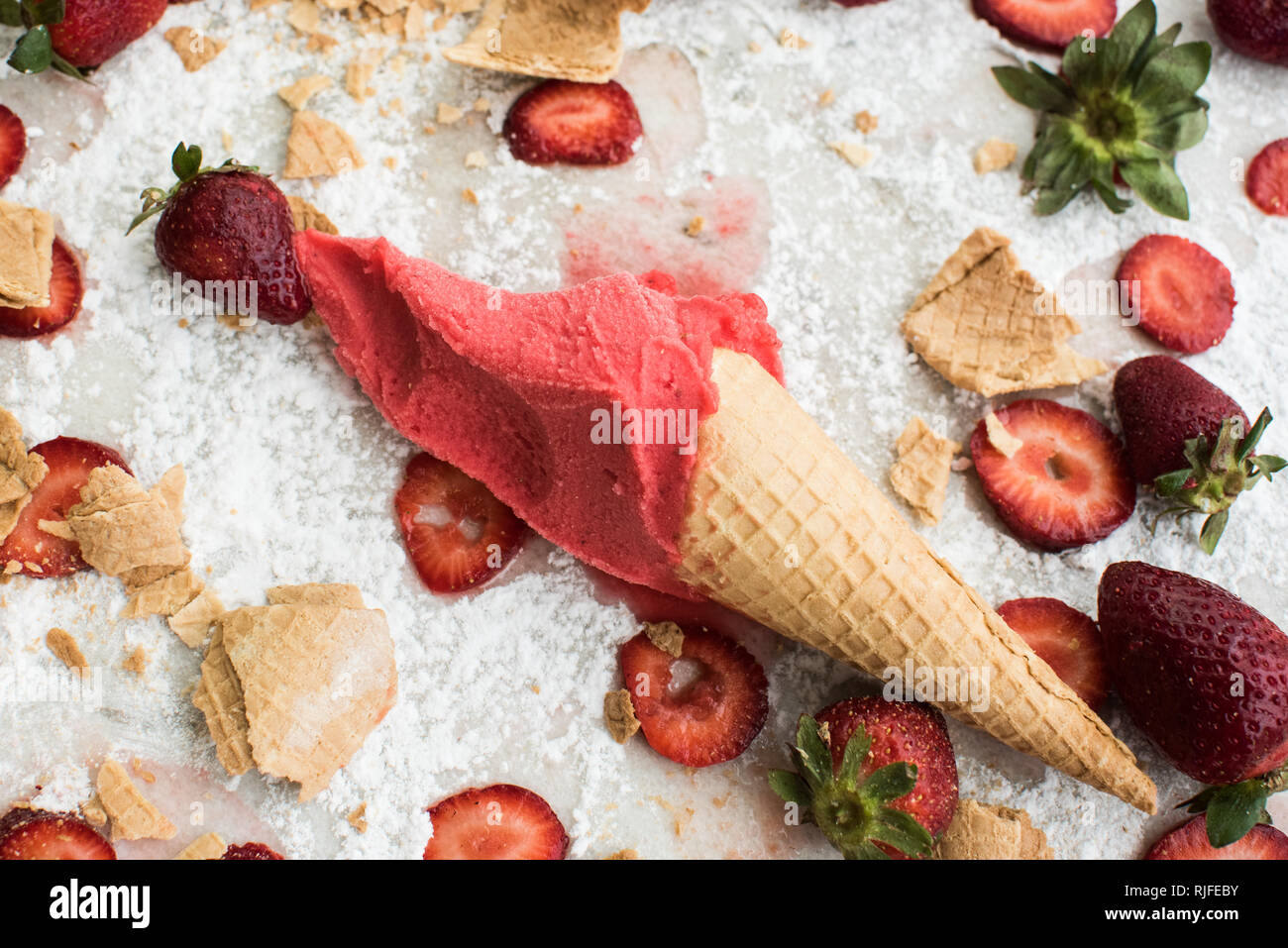 strawberry cornet ice cream surrounded by its homemade ingredients ...