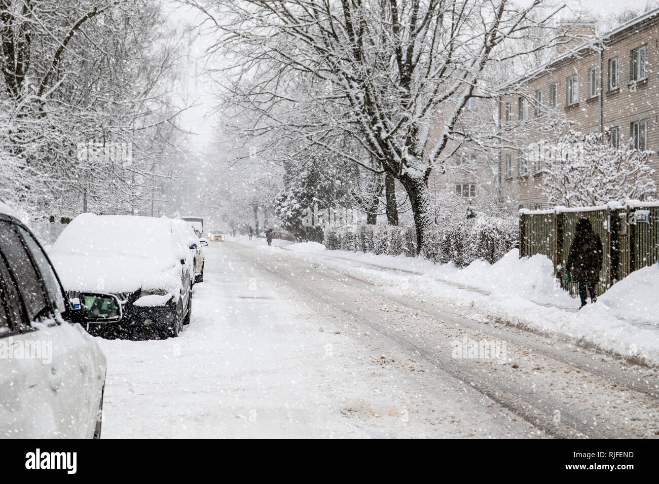Snowstorm, ice and slippery city streets. Impassable roads and snow ...