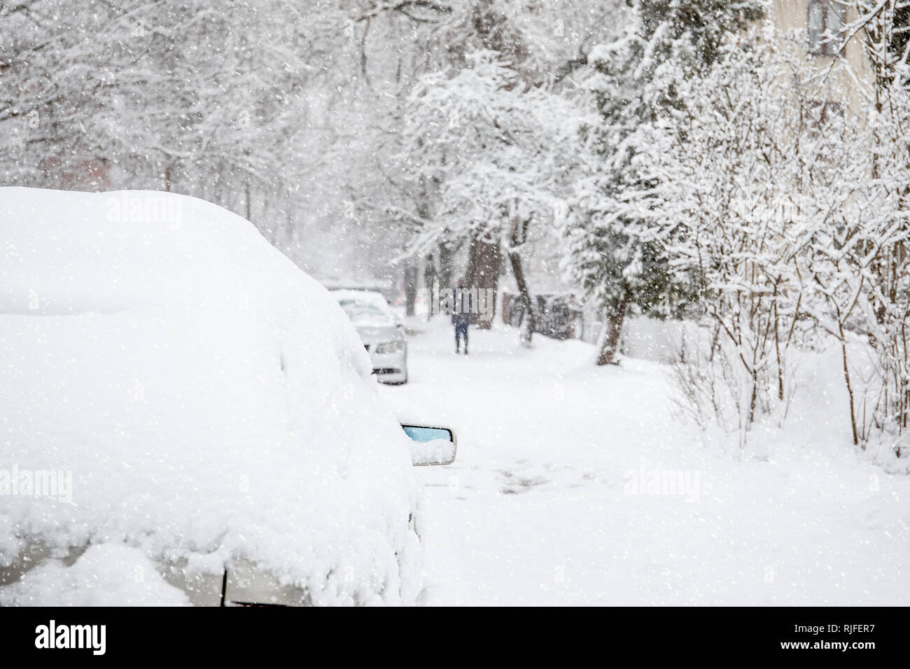 Snowstorm, ice and slippery city streets. Impassable roads and snow ...