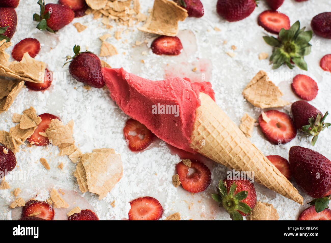 strawberry cornet ice cream surrounded by its homemade ingredients ...