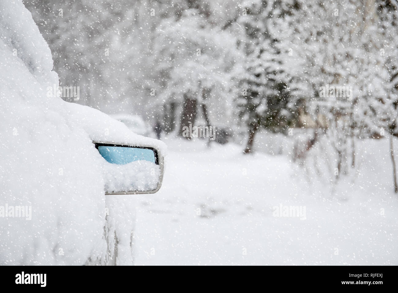 Snowstorm, ice and slippery city streets. Impassable roads and snow ...