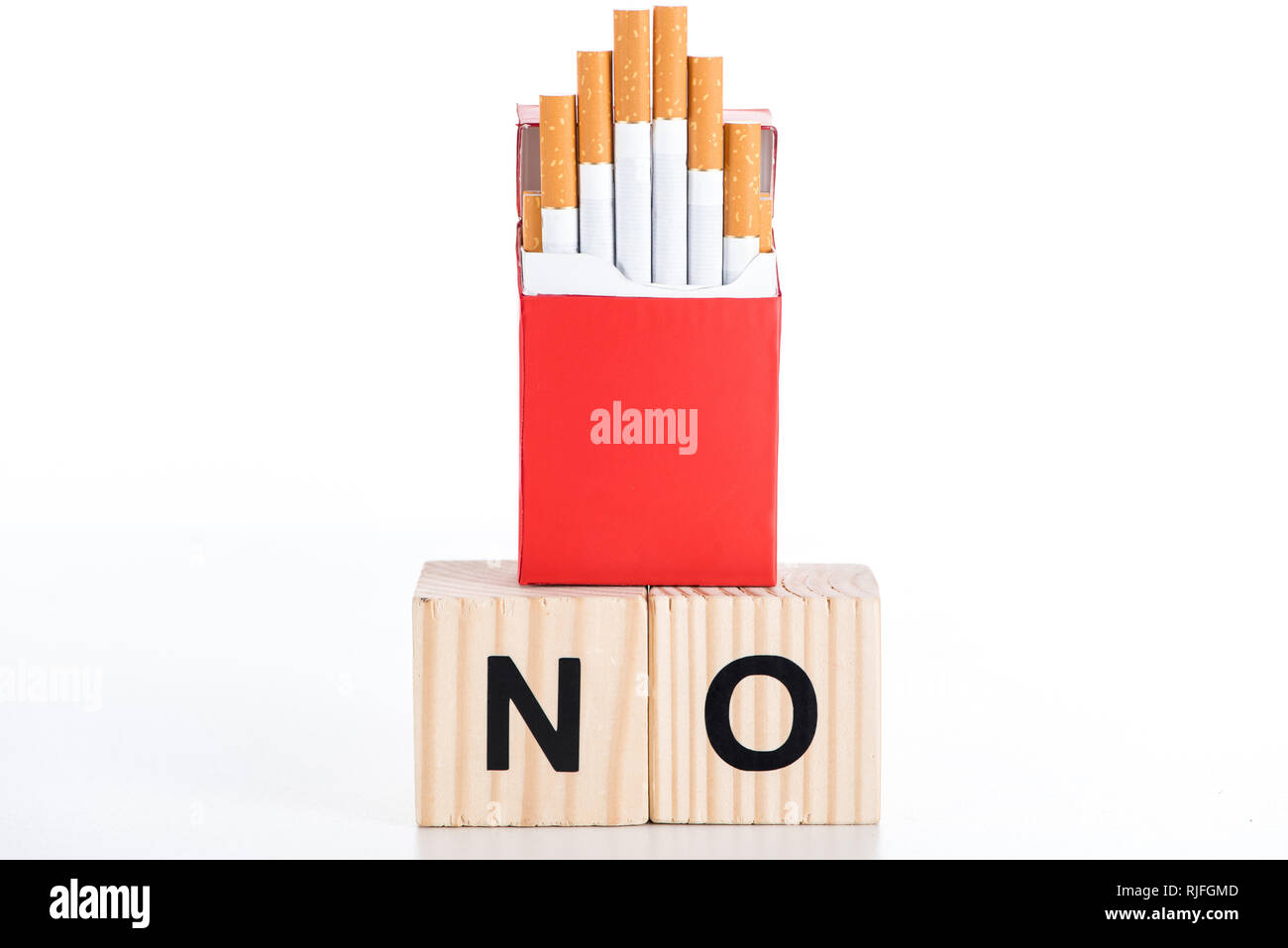 Studio shot of cigarette pack with wooden alphabet cubes isolated on ...