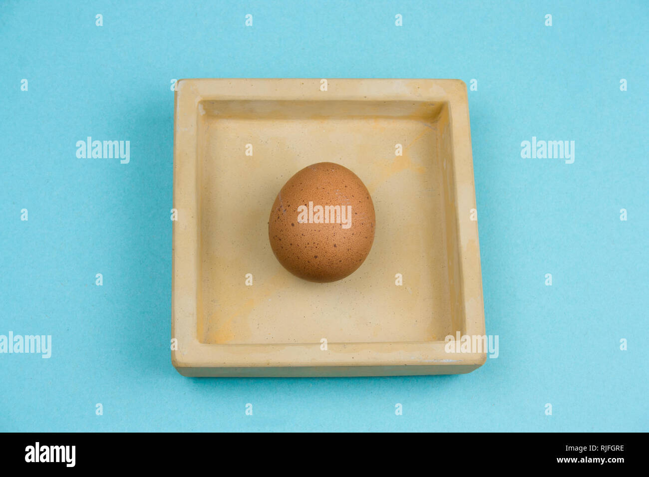 top view egg on a plate on a blue background Stock Photo - Alamy