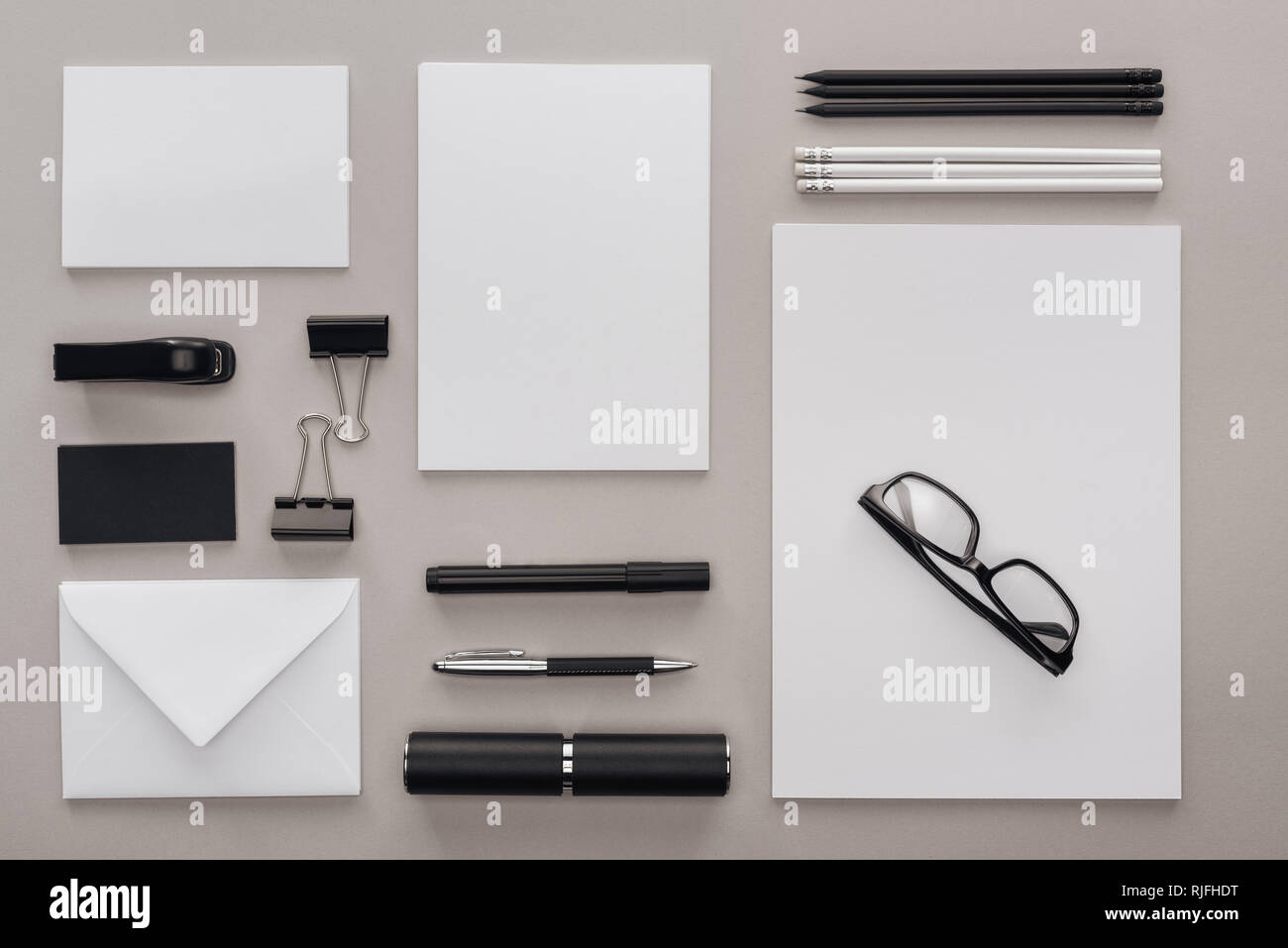 flat lay with black and white stationery and glasses at workplace on ...