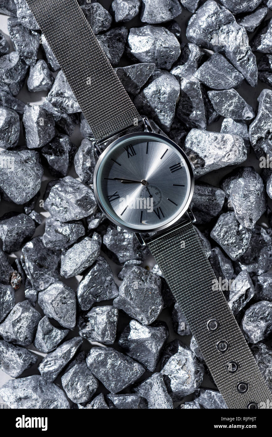 top view of grey watch with clock hands on stones Stock Photo - Alamy