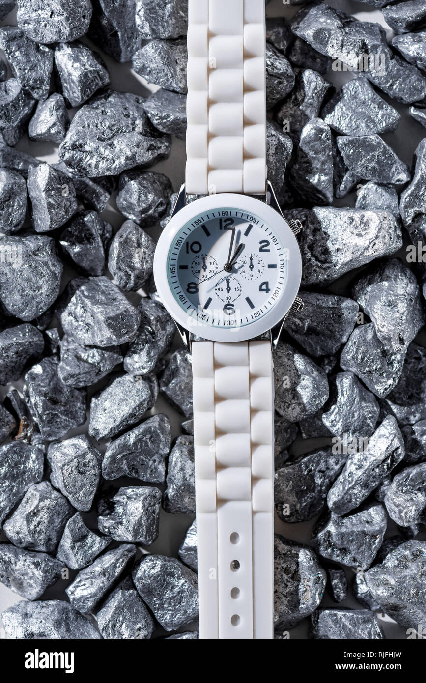 top view of white watch with clock hands on stones Stock Photo - Alamy