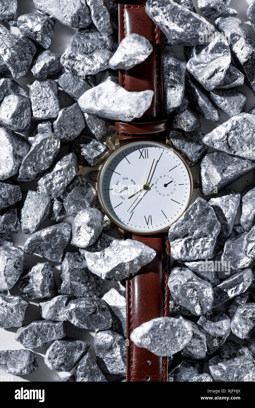 top view of elegant wristwatch with leather watch band on stones Stock ...