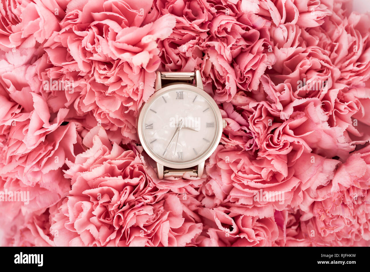 top view of luxury swiss wristwatch lying on blooming flowers Stock ...