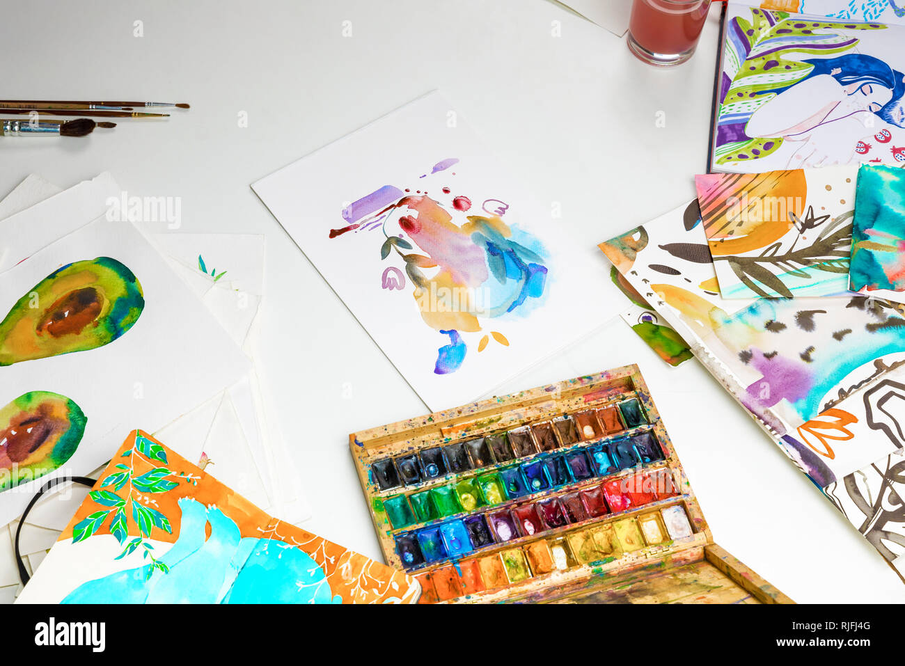 selective focus of colorful paints and watercolor drawings on white ...