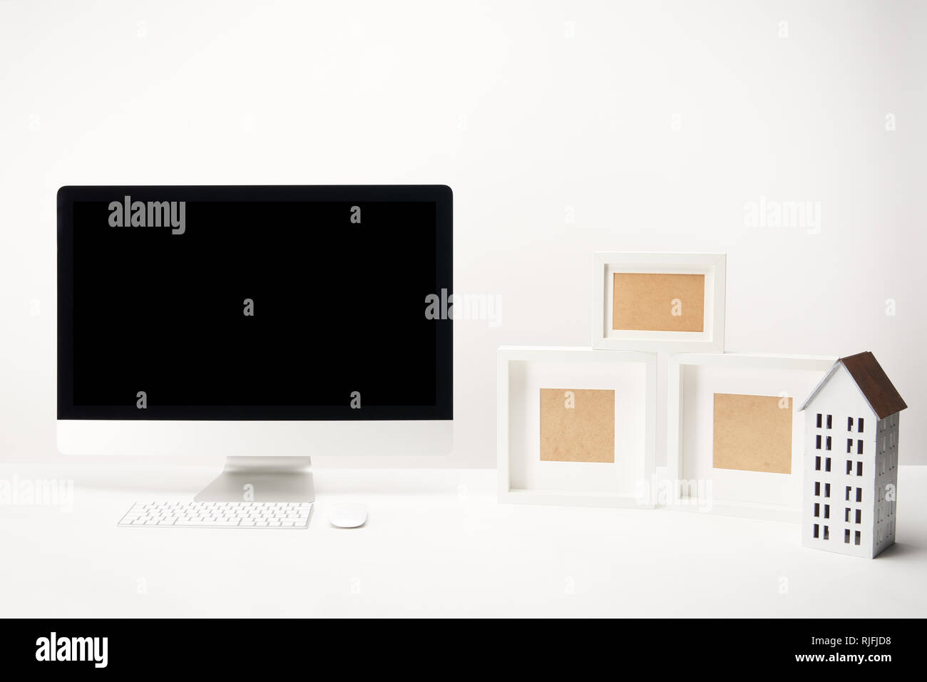 workplace with photo frames and desktop computer with copy space ...