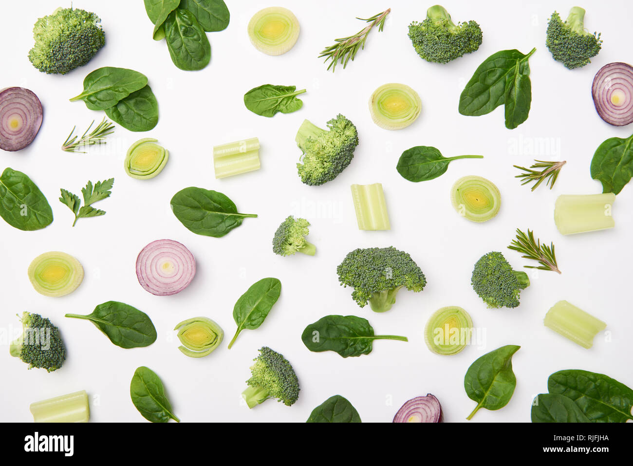 Flat lay with natural cut vegetables on white background Stock Photo ...