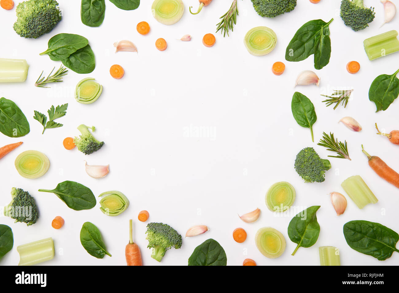 Flat lay with fresh cut vegetables on white background Stock Photo - Alamy