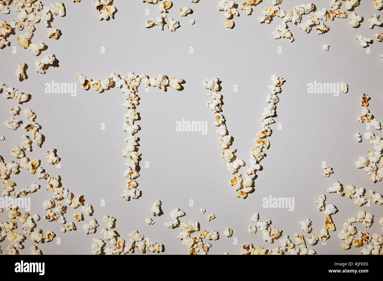 top view of of tasty popcorn with tv lettering isolated on white Stock ...