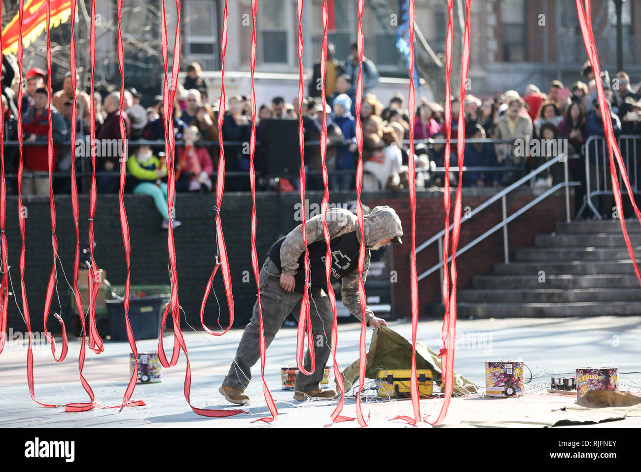 New York, USA. 5th Feb, 2019. A man examines the firecrackers' setup ...