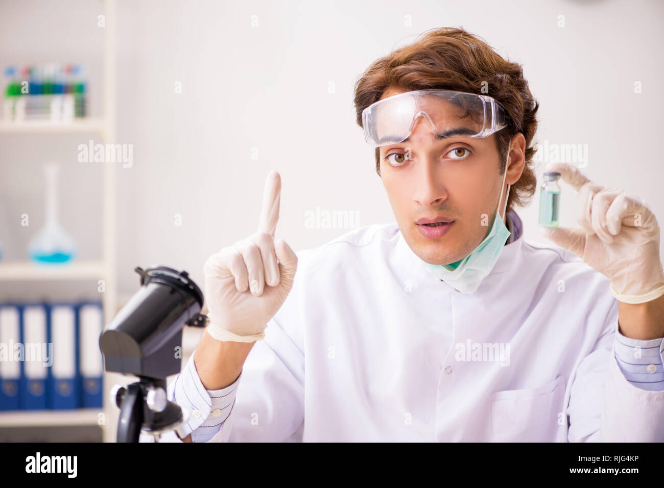 Male entomologist working in the lab on new species Stock Photo - Alamy