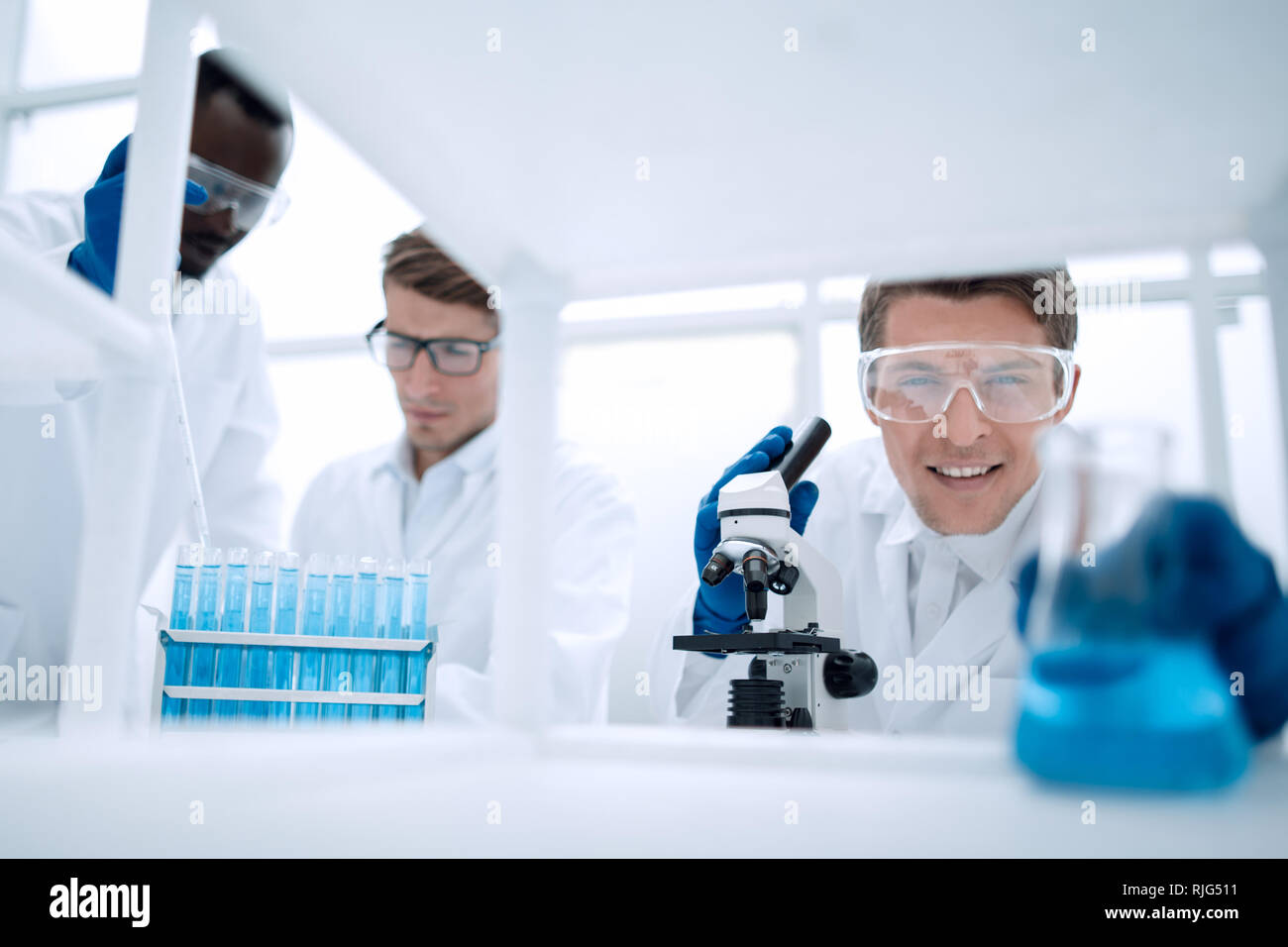 group of microbiologists in the workplace in the laboratory Stock Photo ...