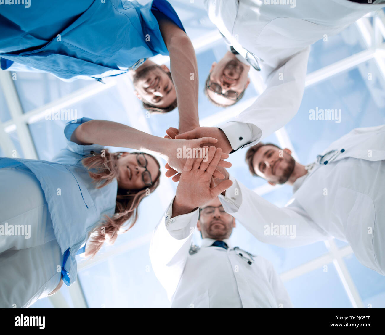 Portrait of a doctor team connecting hands stacking Stock Photo - Alamy