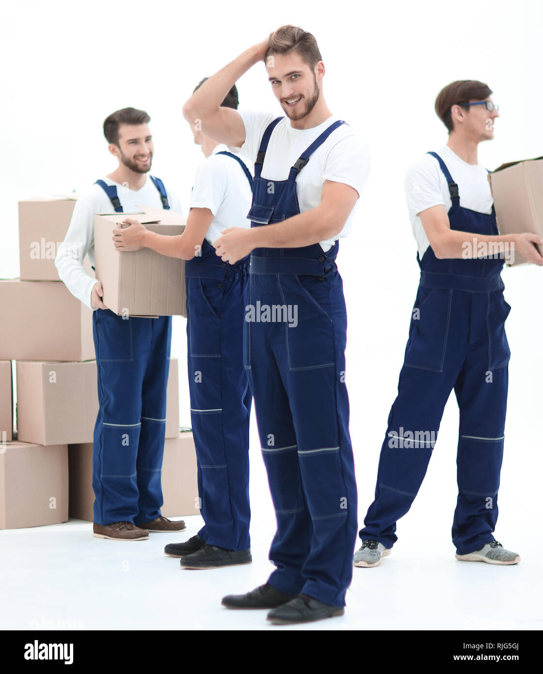 The team of responsible movers and their smiling leader Stock Photo - Alamy