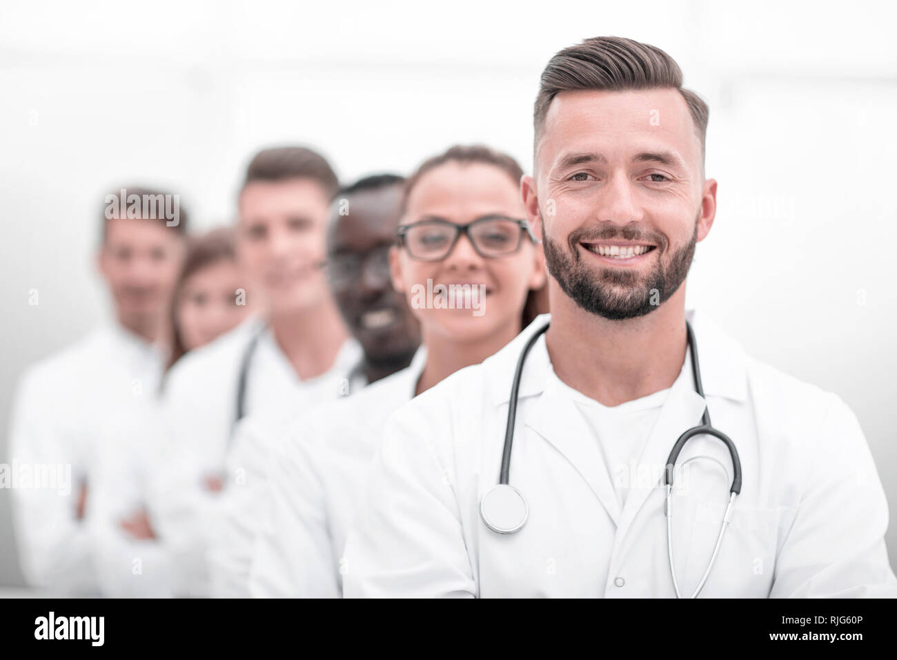 Team of smiling professional doctors standing together Stock Photo - Alamy