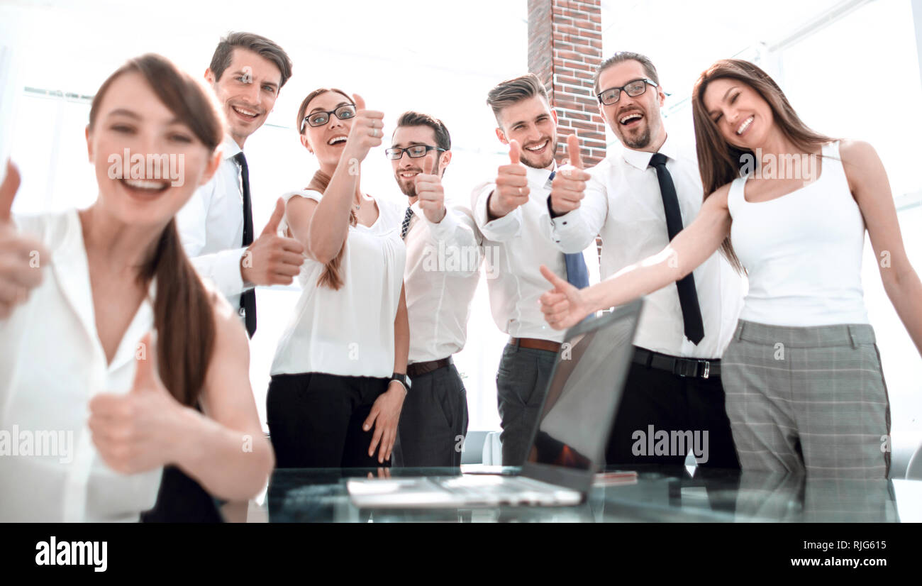 successful business team showing the thumb up Stock Photo - Alamy