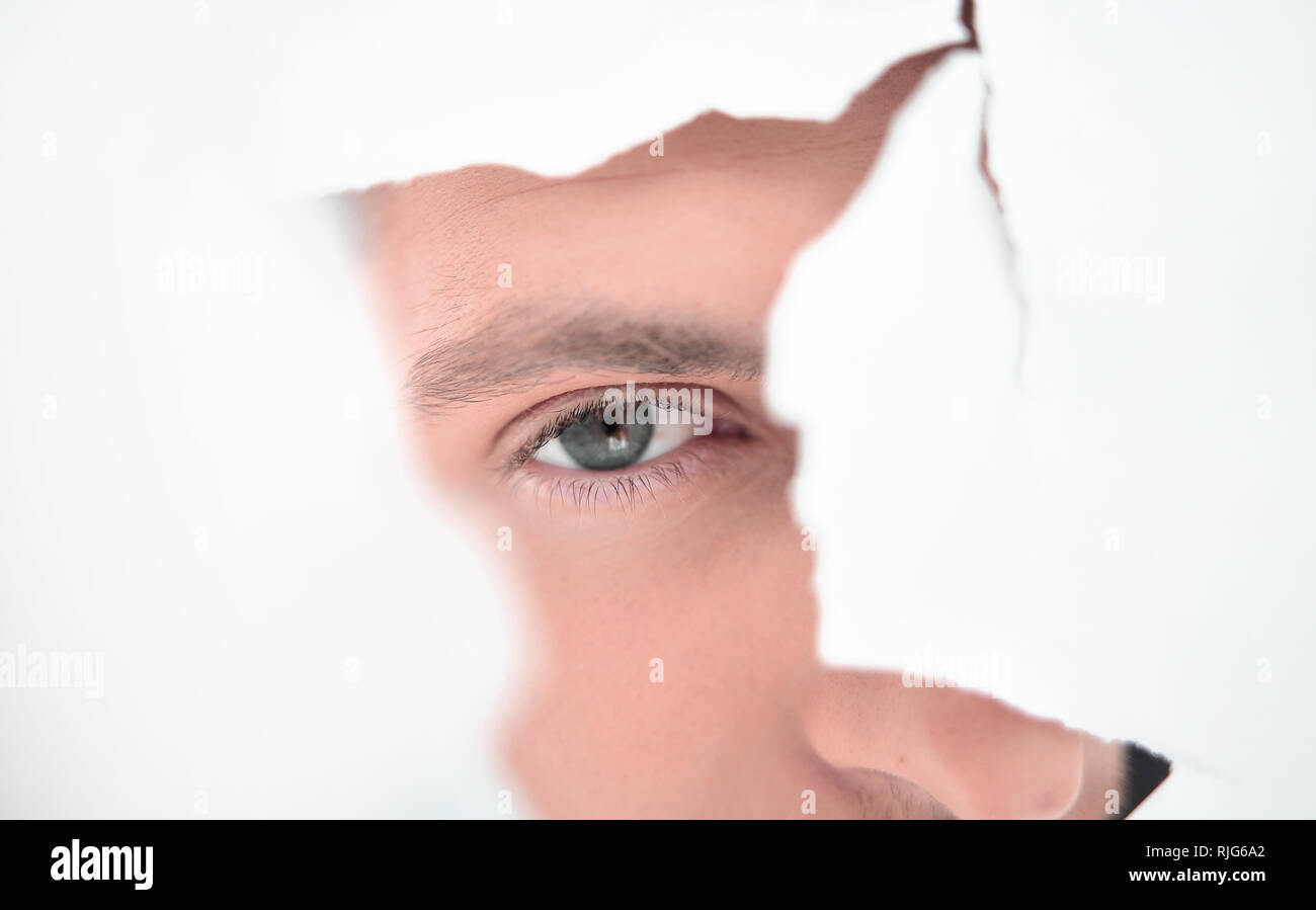 Man looking through hole in wall hi-res stock photography and images ...