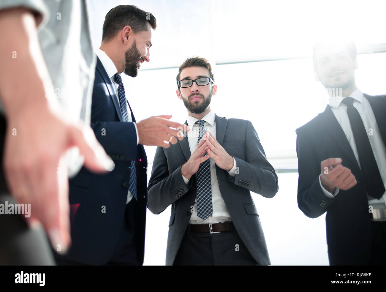 bottom view.group of business people standing in the office Stock Photo ...