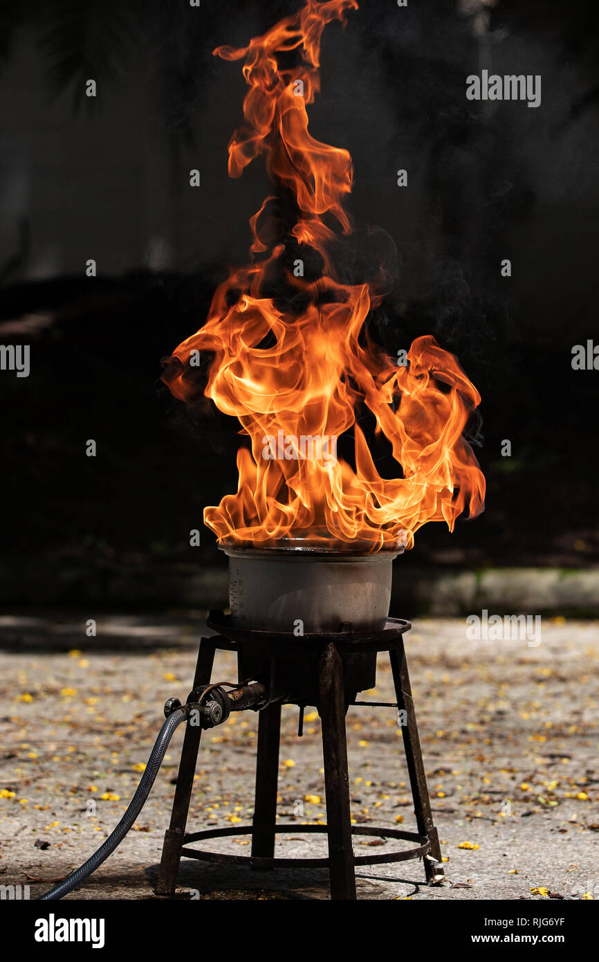 Closeup Fire flames from pot while cooking Stock Photo - Alamy