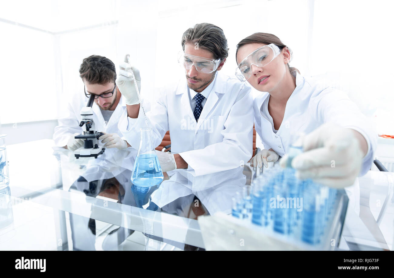 Scientist holding test tube or some equipment of science Stock Photo ...