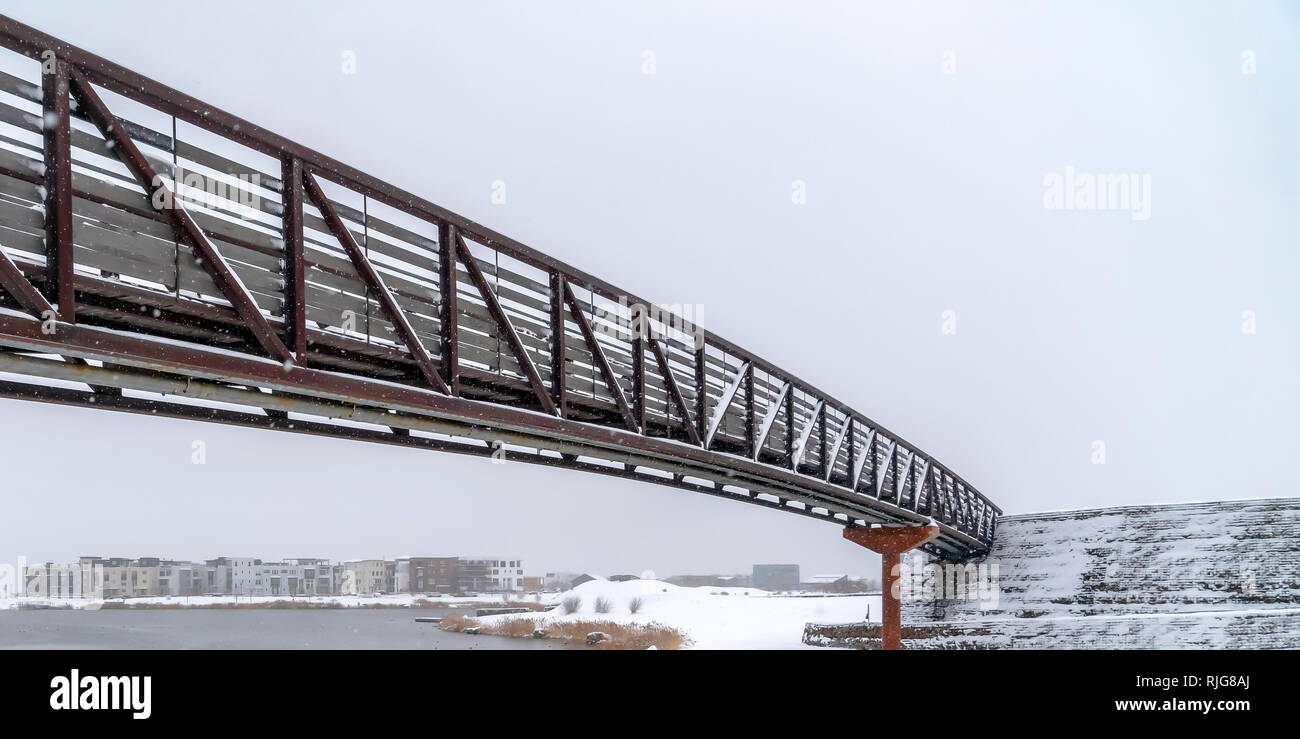 Winter lake scene with snowy bridge in Daybreak Stock Photo - Alamy
