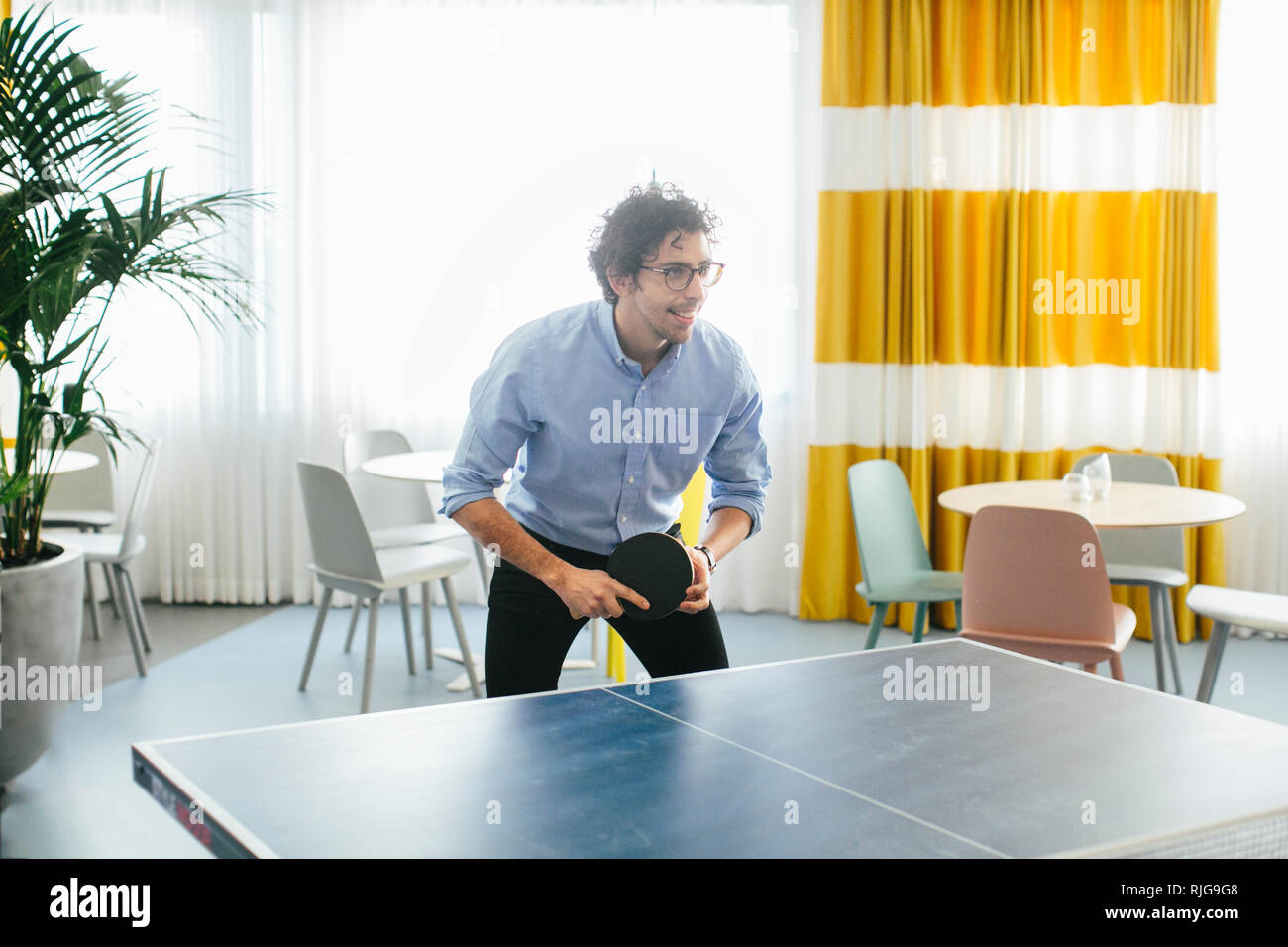Man playing table tennis Stock Photo - Alamy