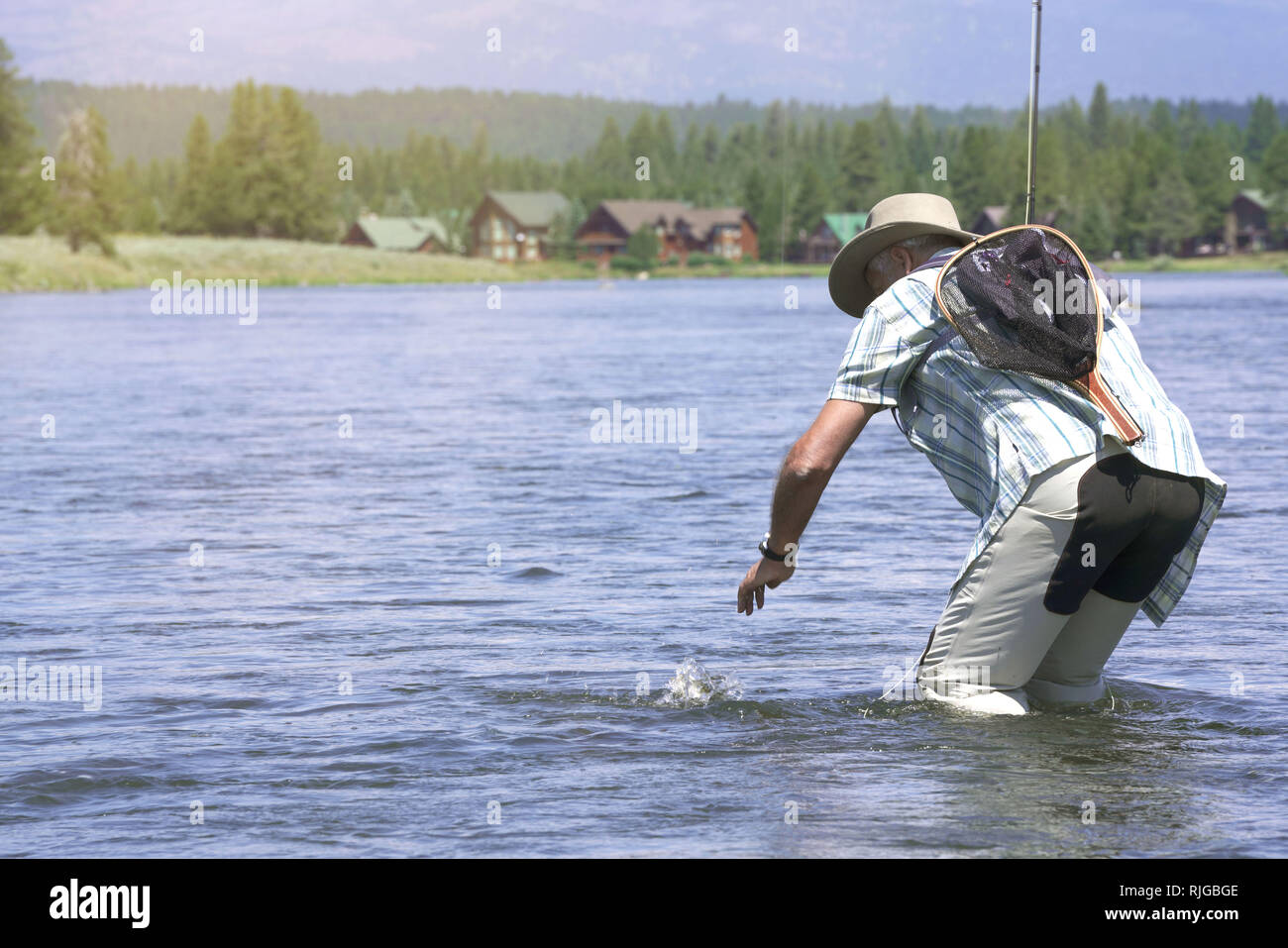 Fly fisherman catching fish hi-res stock photography and images - Alamy