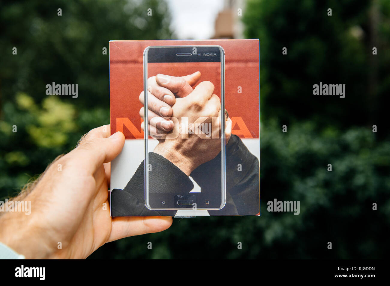 PARIS, FRANCE - AUG 1, 2018: Man hand holding new box of Nokia 6 ...