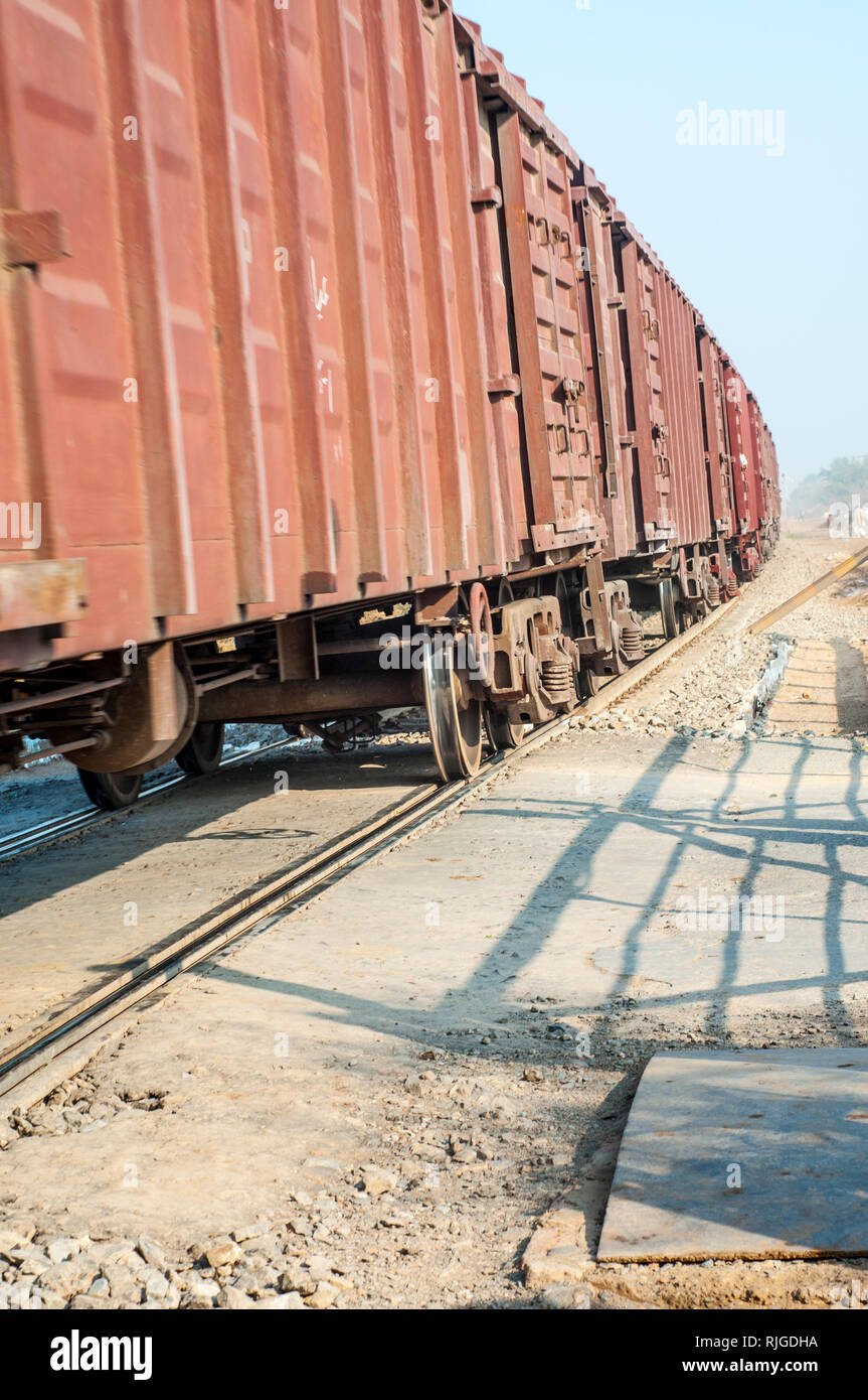 Logistic train passing through crossing Stock Photo - Alamy