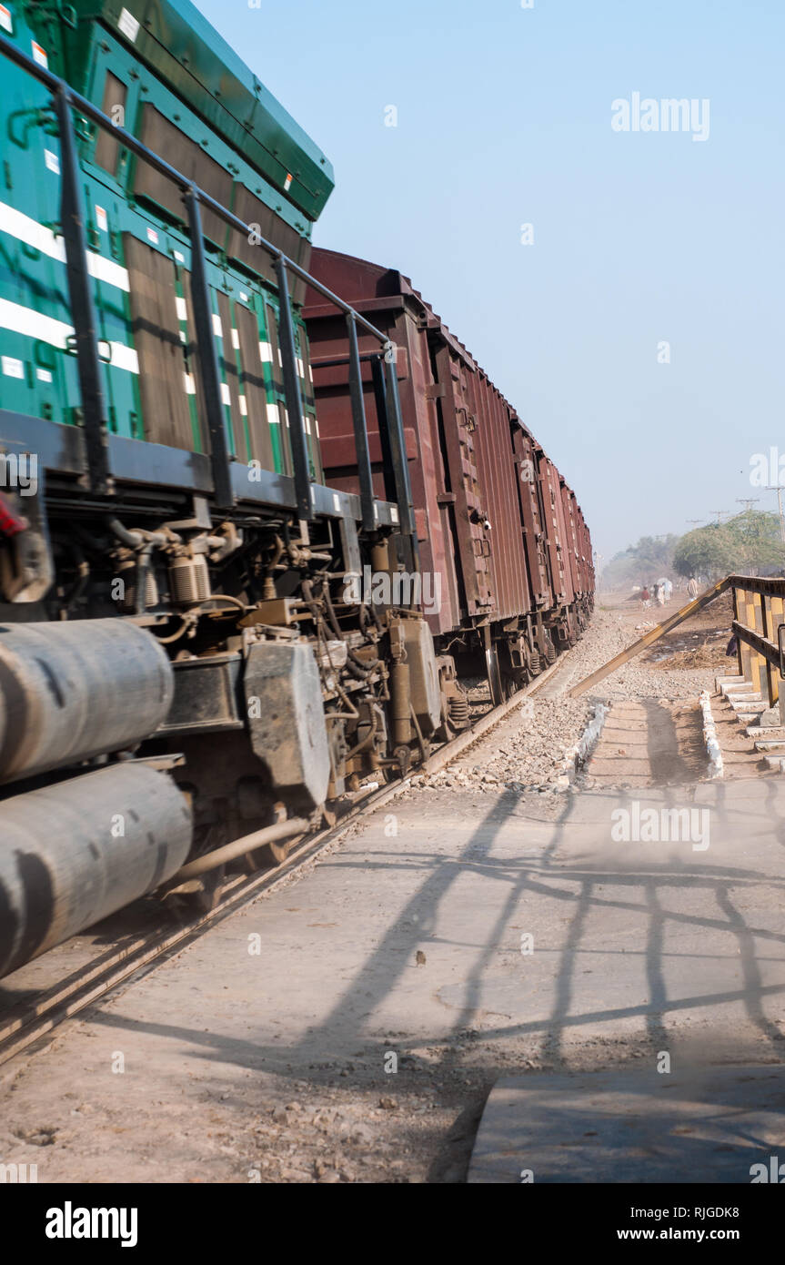 Freight train passing through the countryside Stock Photo - Alamy