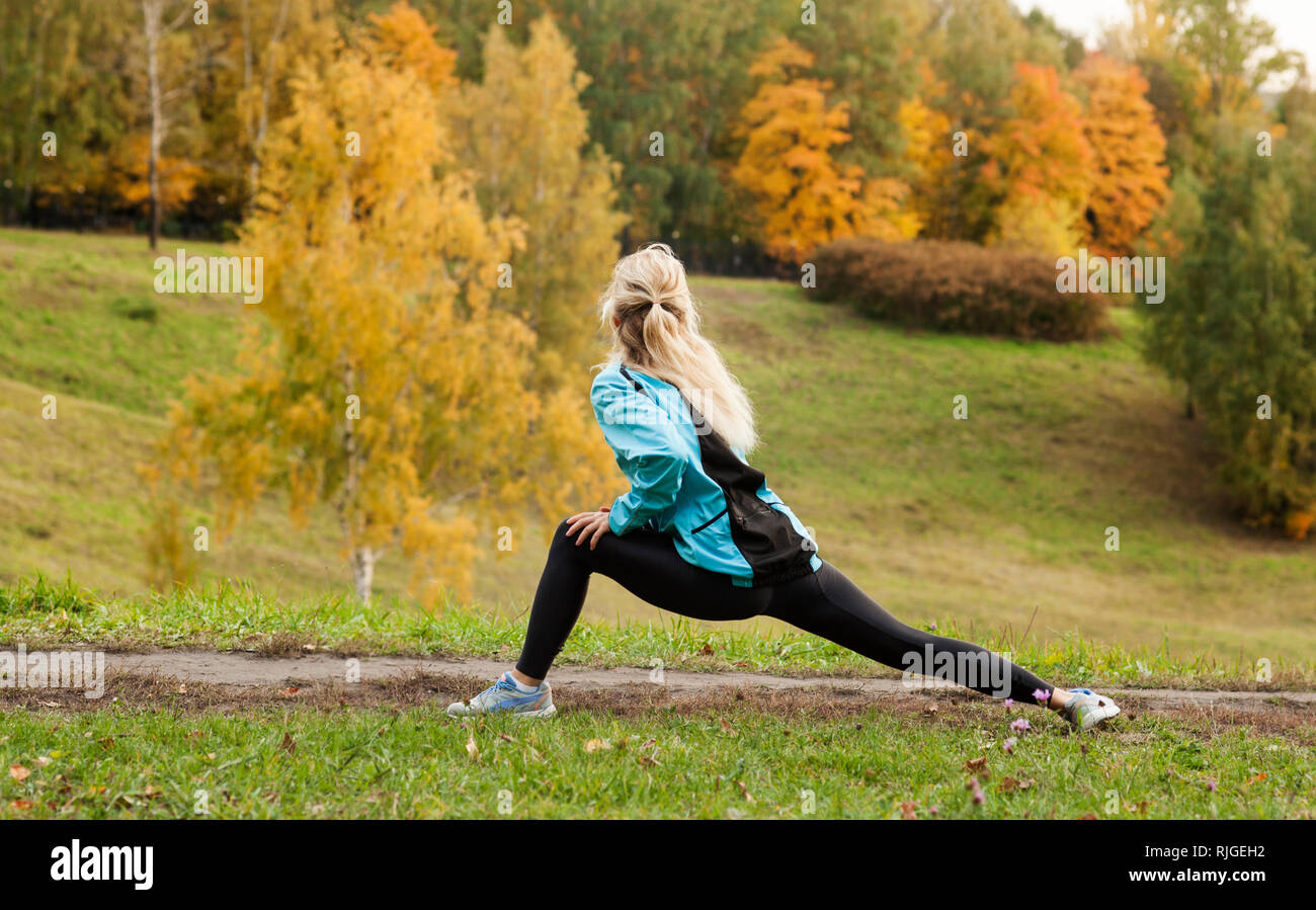 running along a park path, healthcare and problem concept - close-up of ...