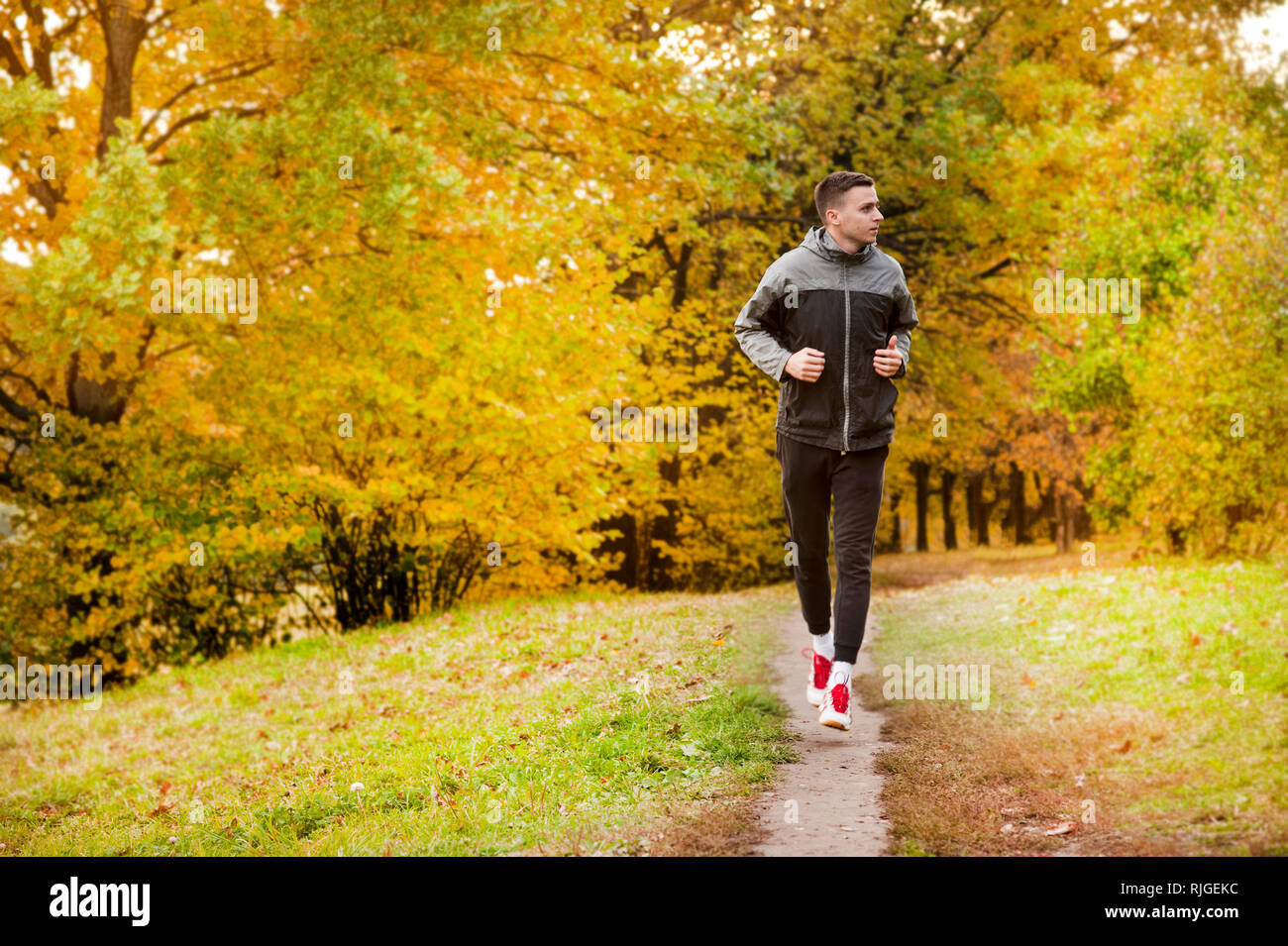 running along a park path, healthcare and problem concept - close-up of ...