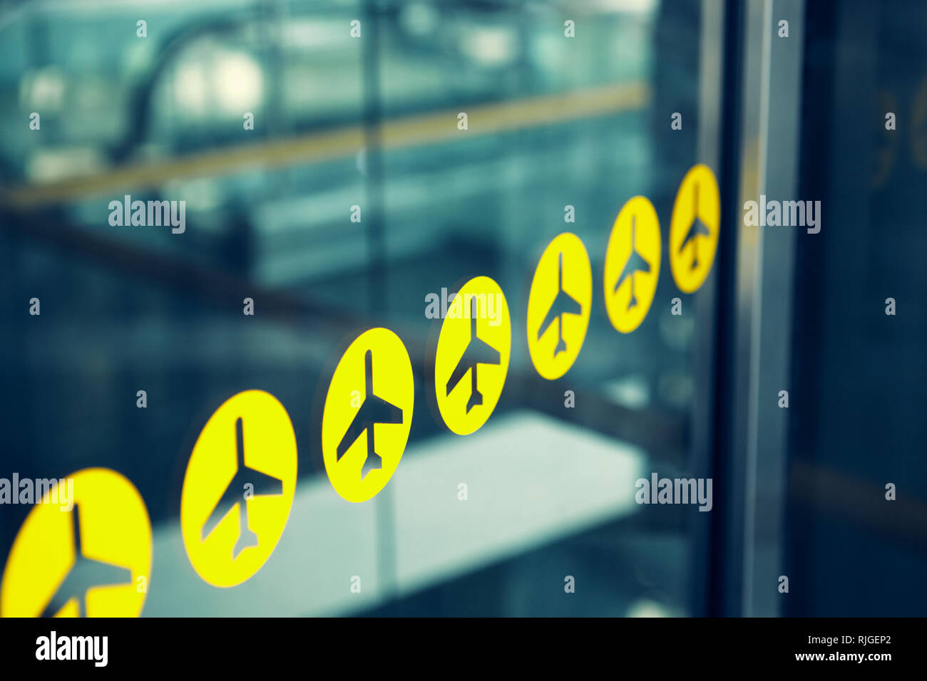 Plane signs on glass, close-up Stock Photo - Alamy