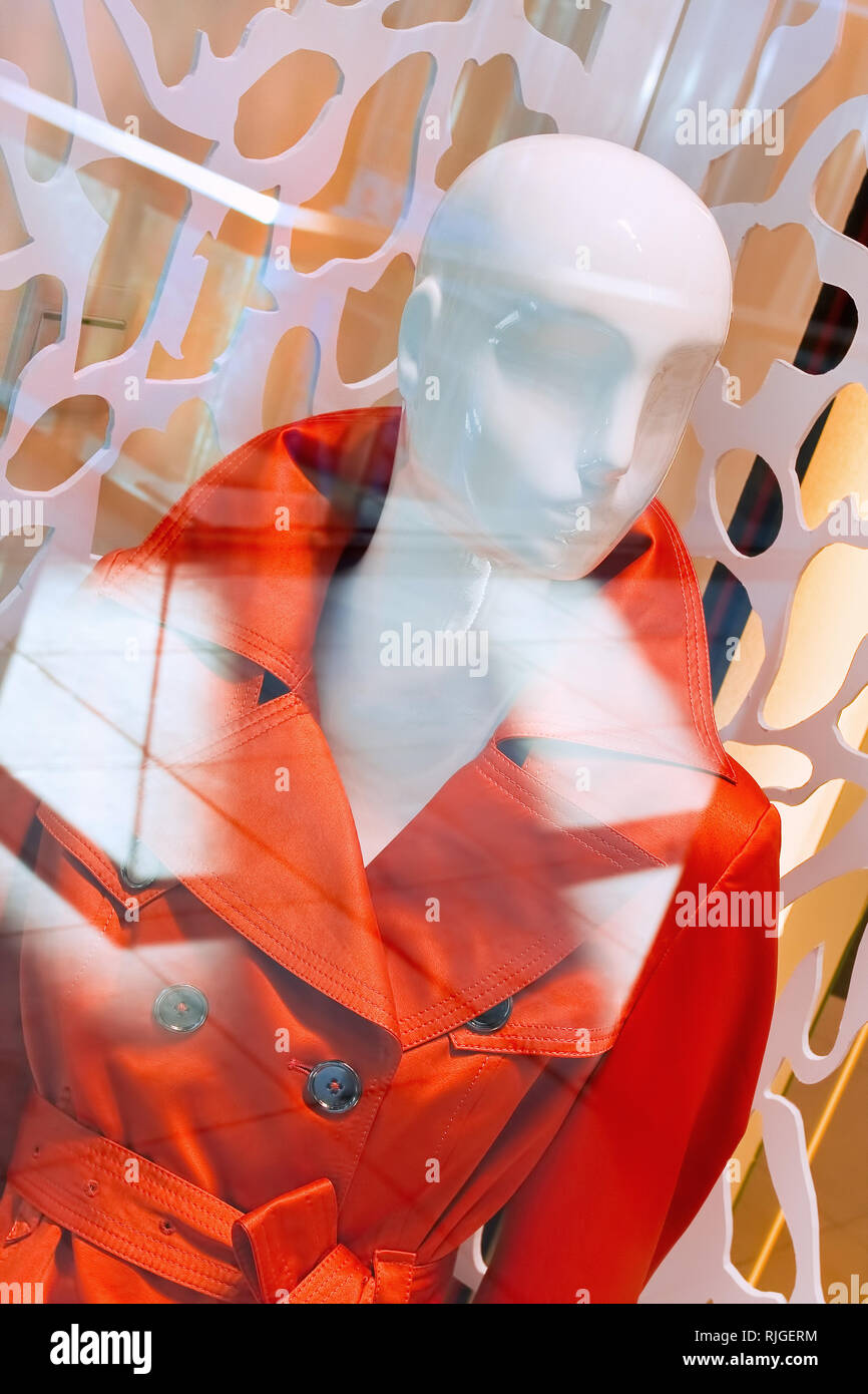 Fashion dummy in window with glass reflection Stock Photo - Alamy