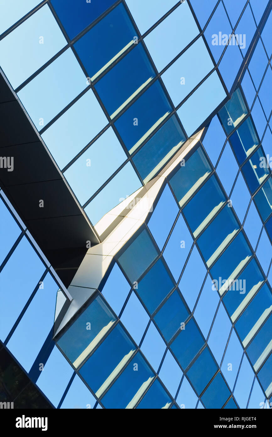 Blue glass surface of a modern office building Stock Photo - Alamy