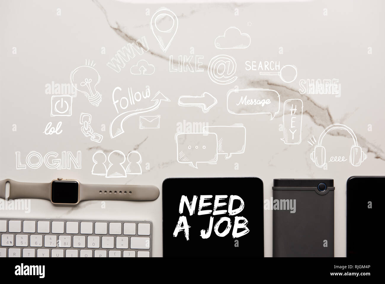 flat lay with various wireless devices and icons with need a job ...