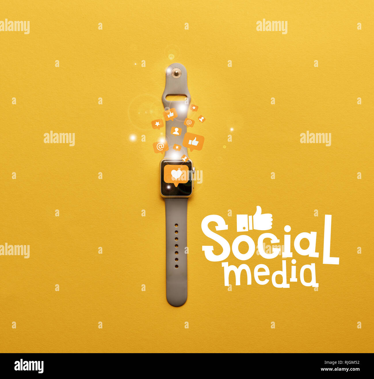 top view of smartwatch with icons and social media lettering on yellow ...