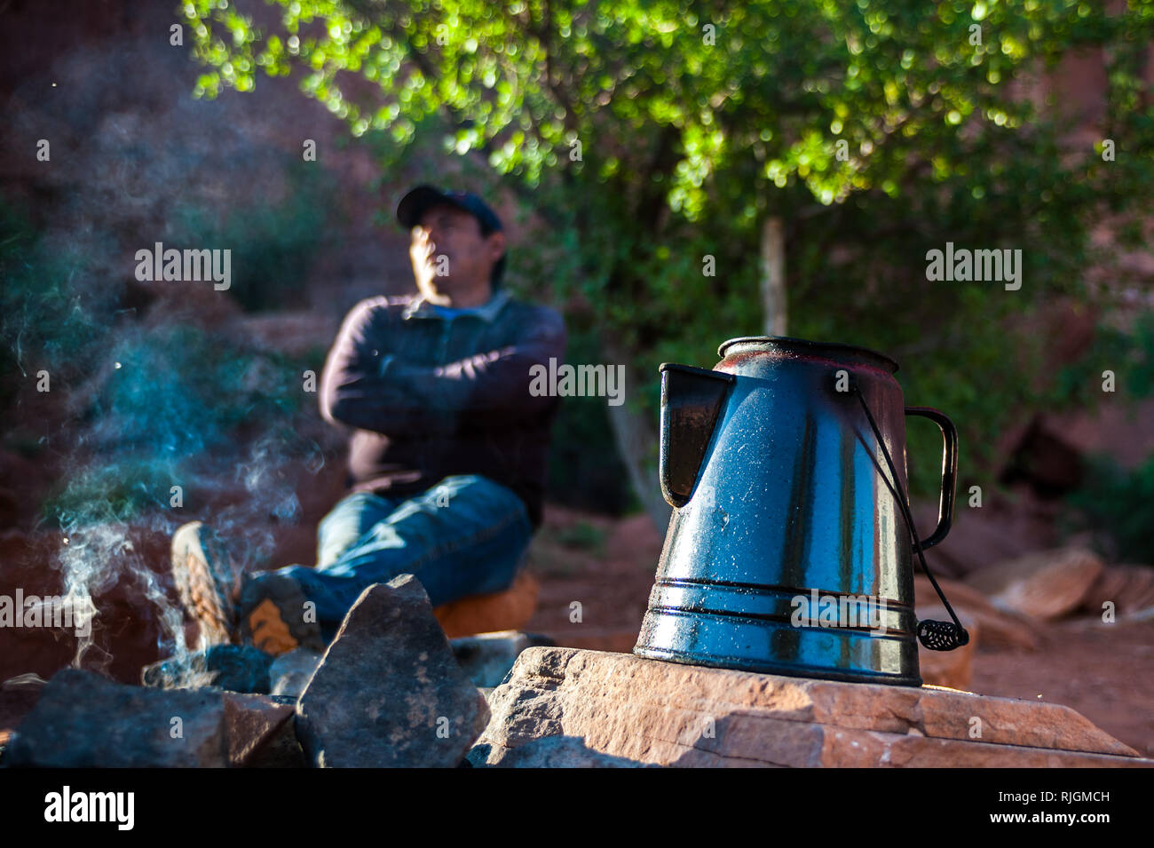 Navajo native preparing coffe in the morning, Monument Valley ...