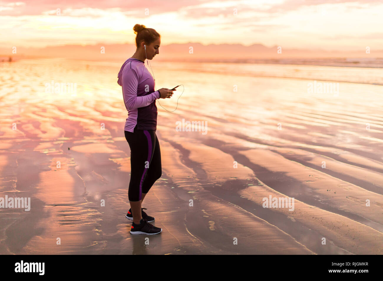 Beautiful sportswoman choosing music hi-res stock photography and ...